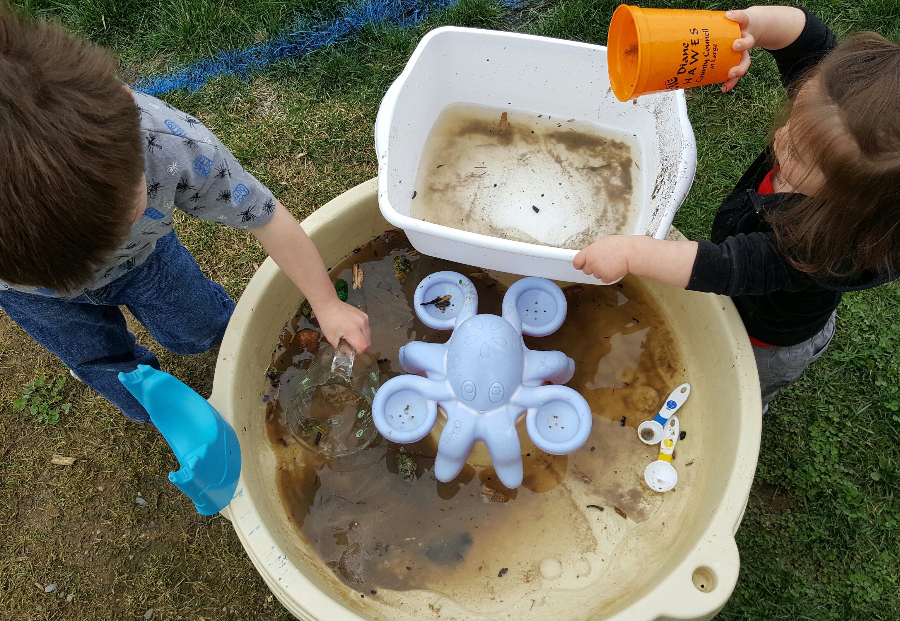 Mud and a Water Bucket: Outdoor Unstructured Play for Toddlers – Stay ...